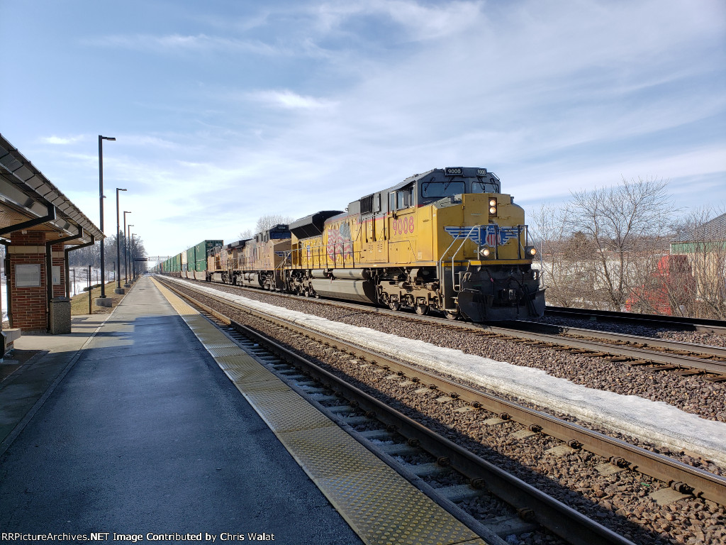 UP 9008 leads a east bound stack train